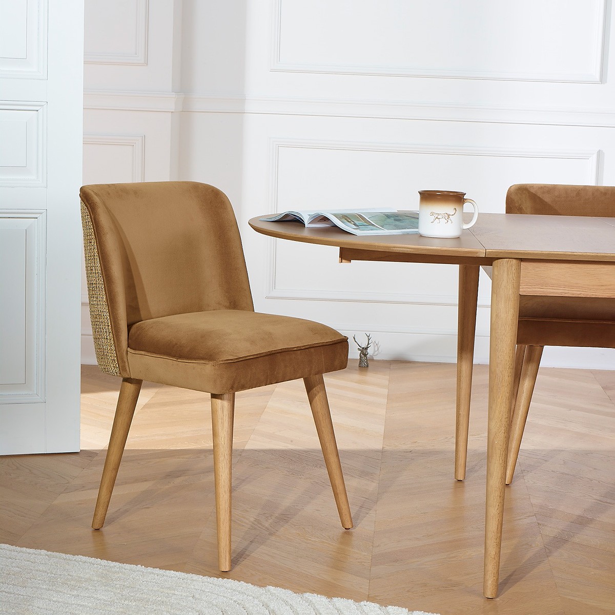 Scandinavian dining chairs in wood, velvet fabric, and tweed